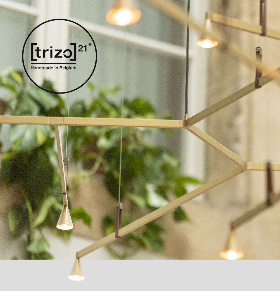 Architectural lighting in brass and glass for refined interiors Trizo21